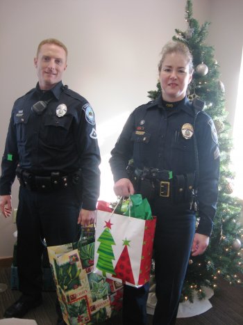 Concord police deliver presents for Holiday Tree - The Concord Insider