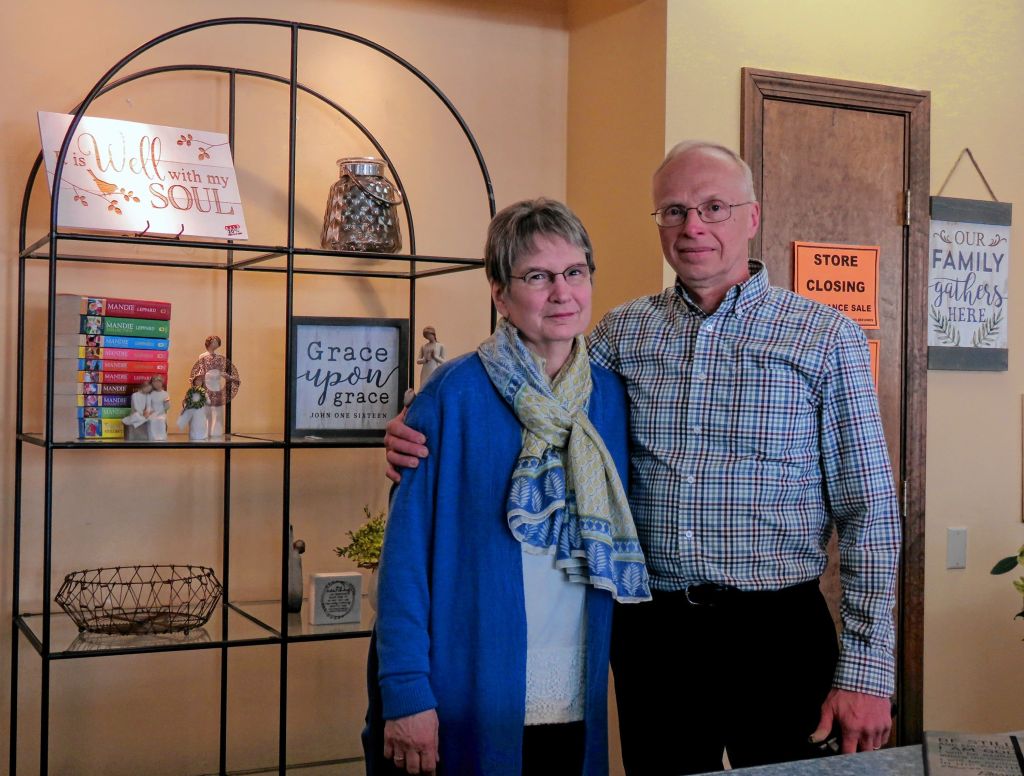 Mark and Jane Cheeseman stand at the counter of Parable Bible Bookstore ...