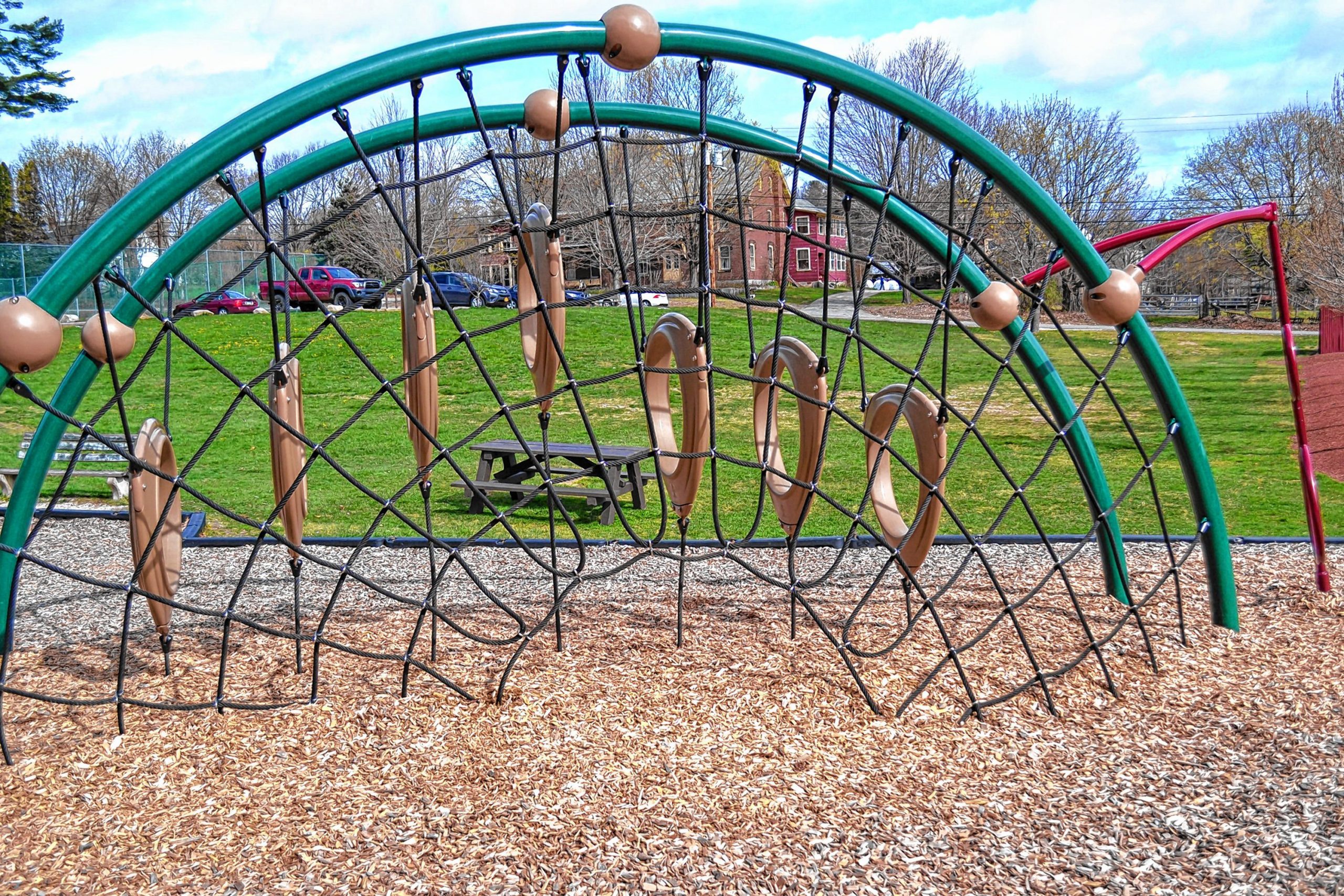 Climb across a rope spider’s web at Garrison Park. - The Concord Insider